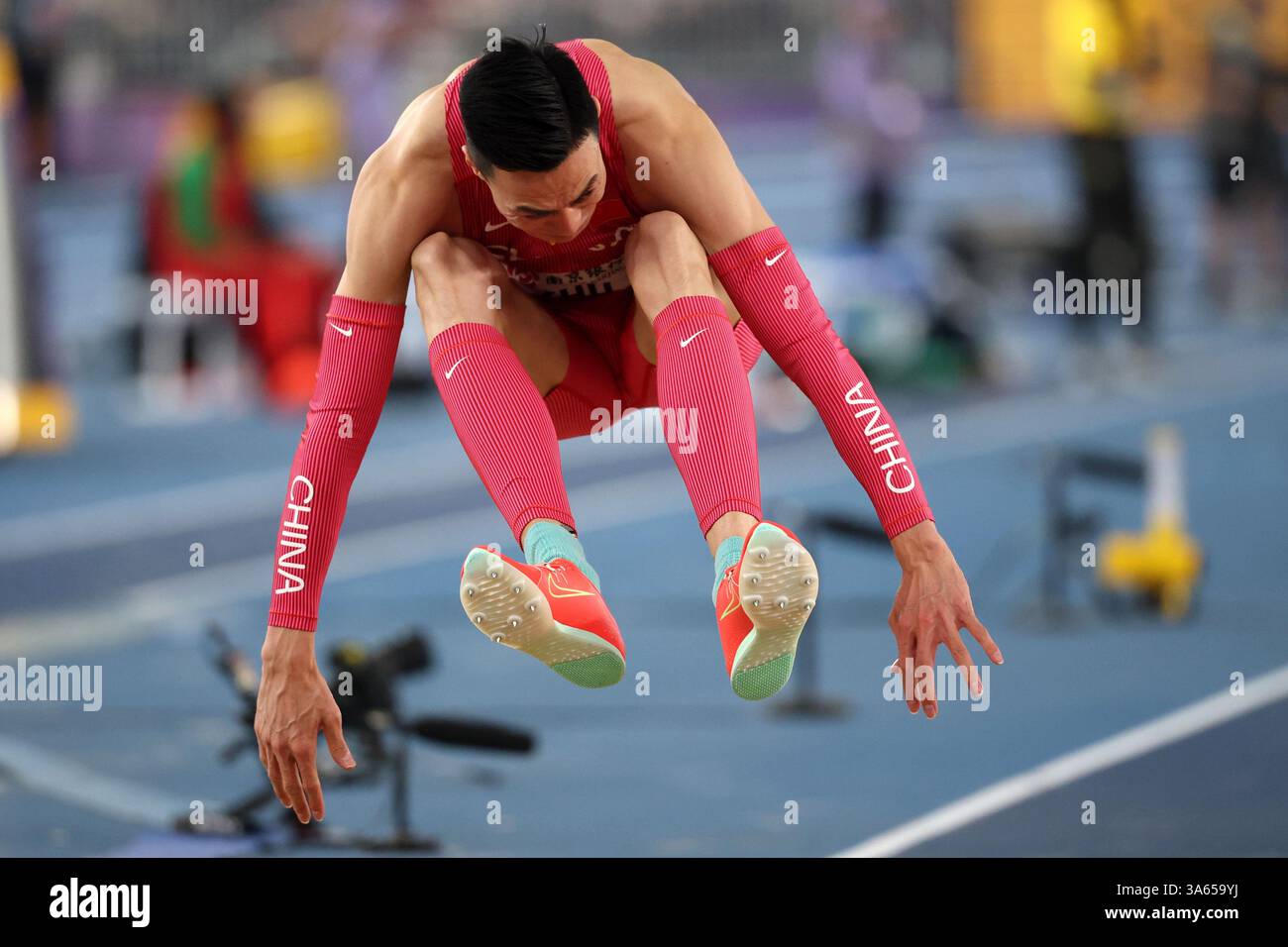 Nanjing,China.21th March 2025. Zhu Yaming of China wins silver in men’s triple jump final with ...