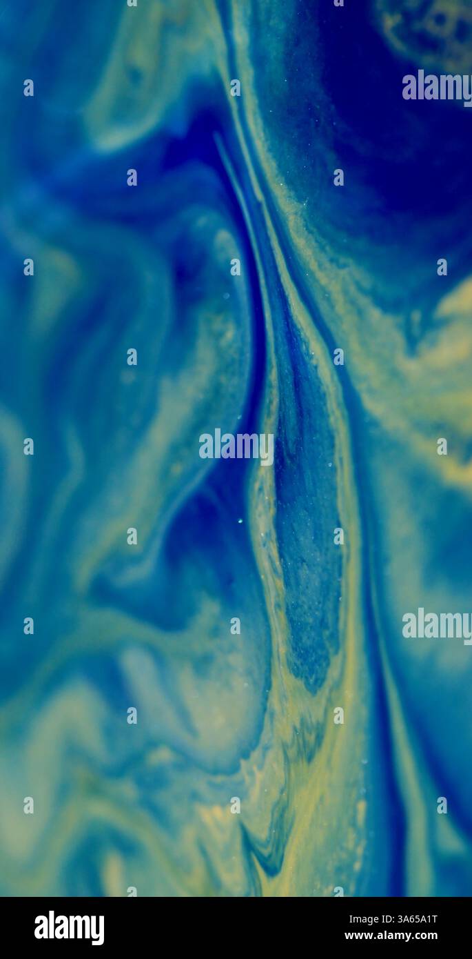 Ripple paint. Shiny fluid. Defocused blue yellow golden colorful marble ...