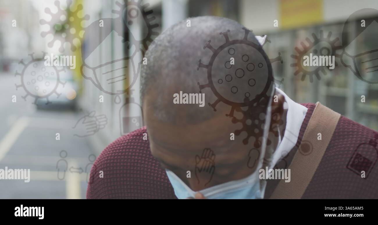 Image of covid 19 icons over african american man sneezing wearing face ...
