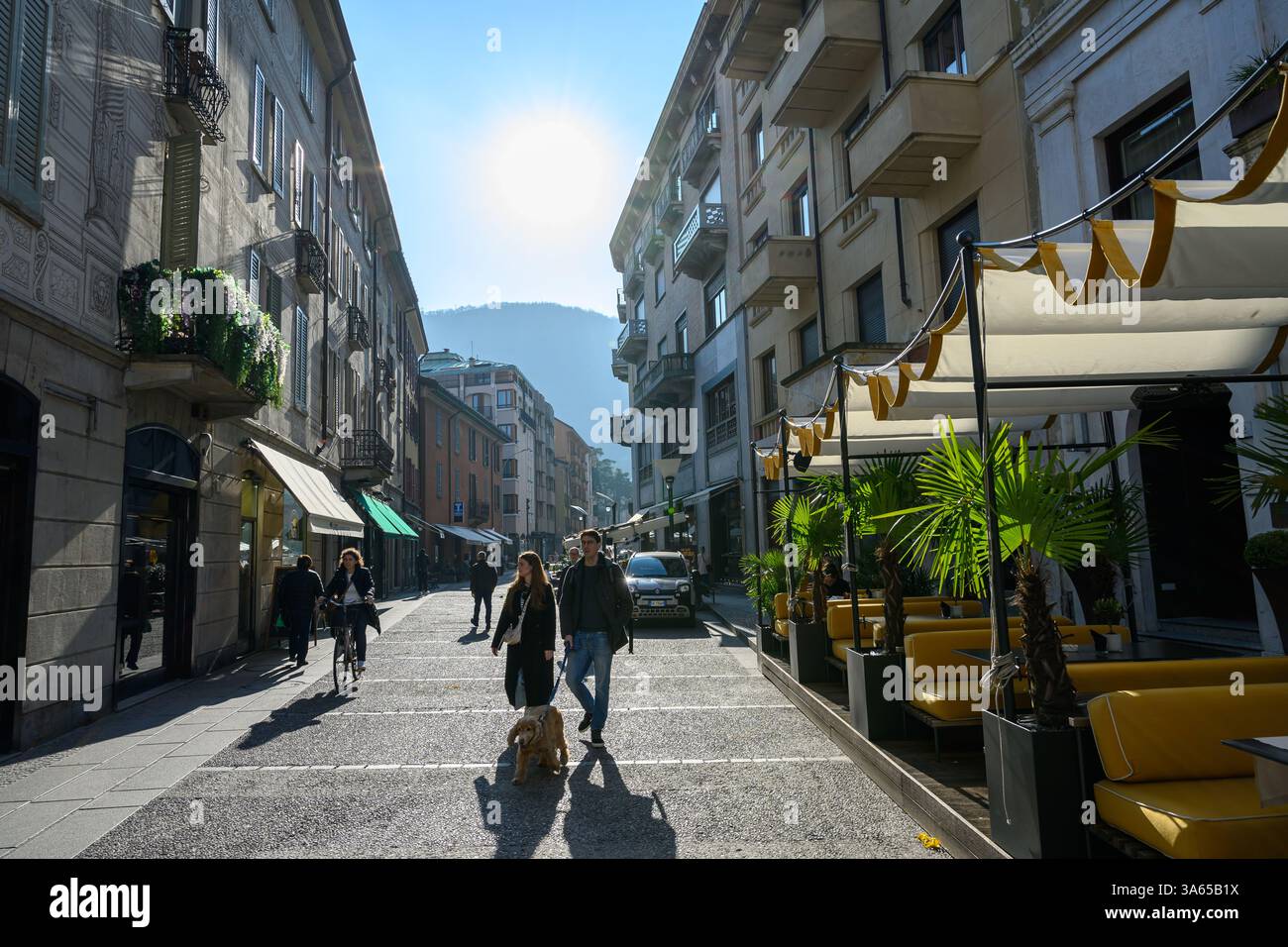 People walking down the Via Giuseppe Garibaldi street – Como, Italy ...