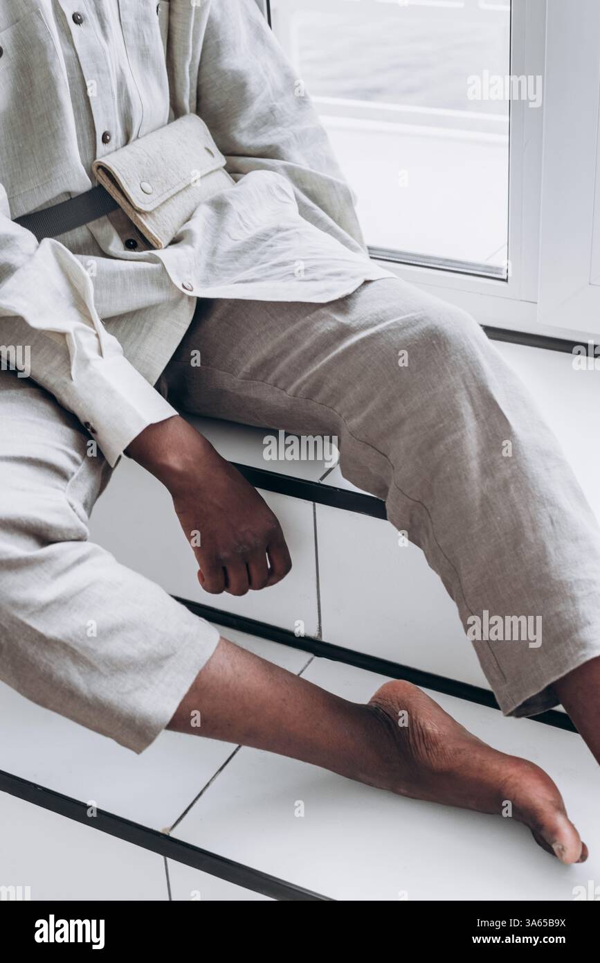 Fashion-conscious individual showcasing a relaxed and stylish pose on ...