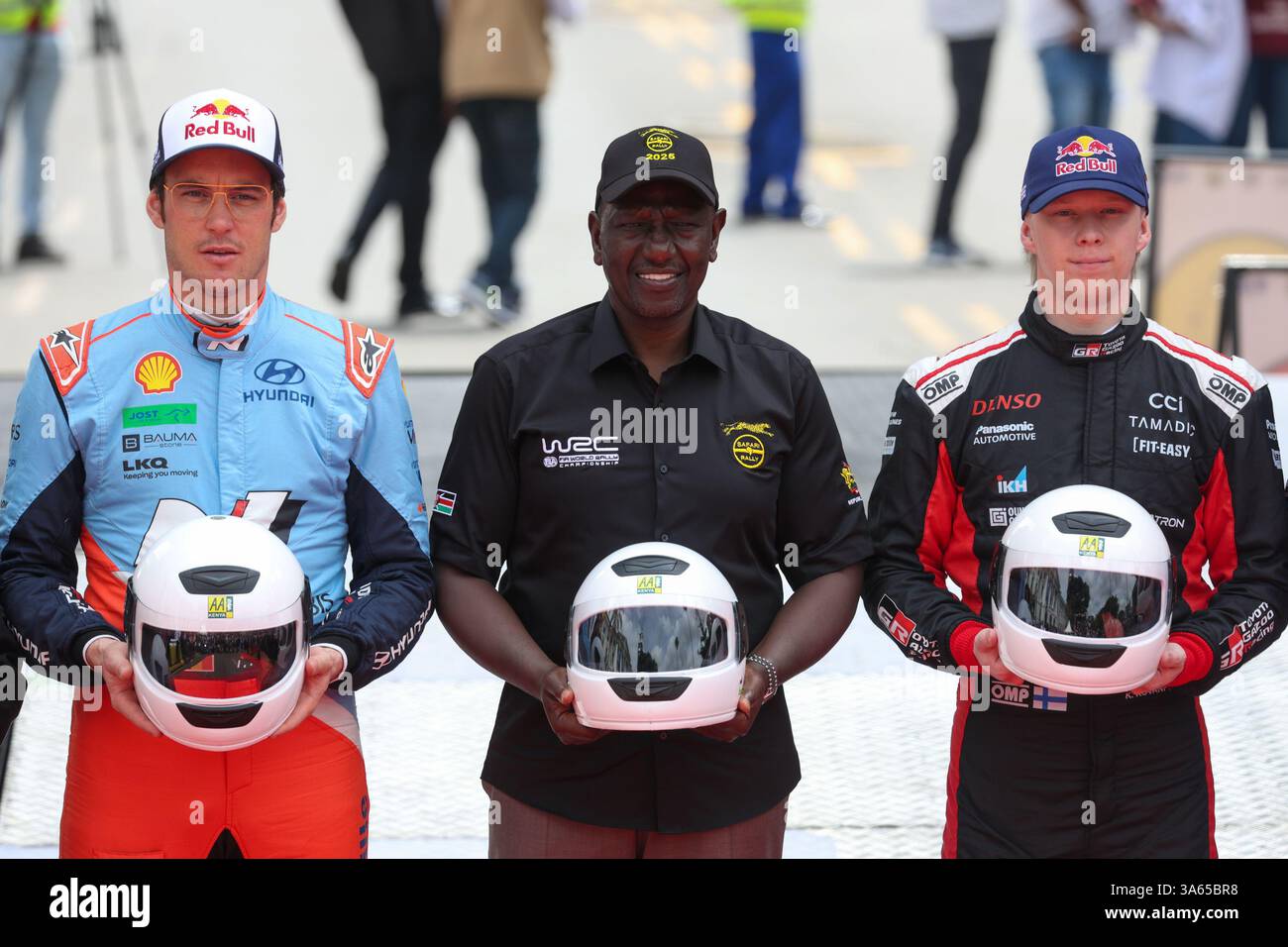 Kenyan President William Ruto poses for a photo with Kalle Rovanperä and Thierry Neuville with a ...
