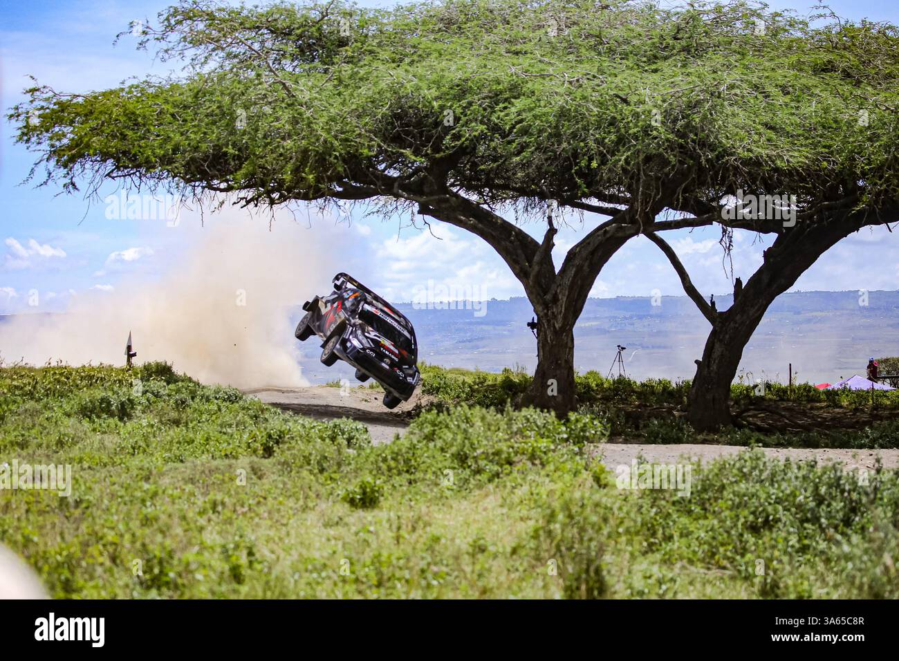 A photo of a rally over a jump at Miti-Mbili Kedong 1. Safari Rally ...