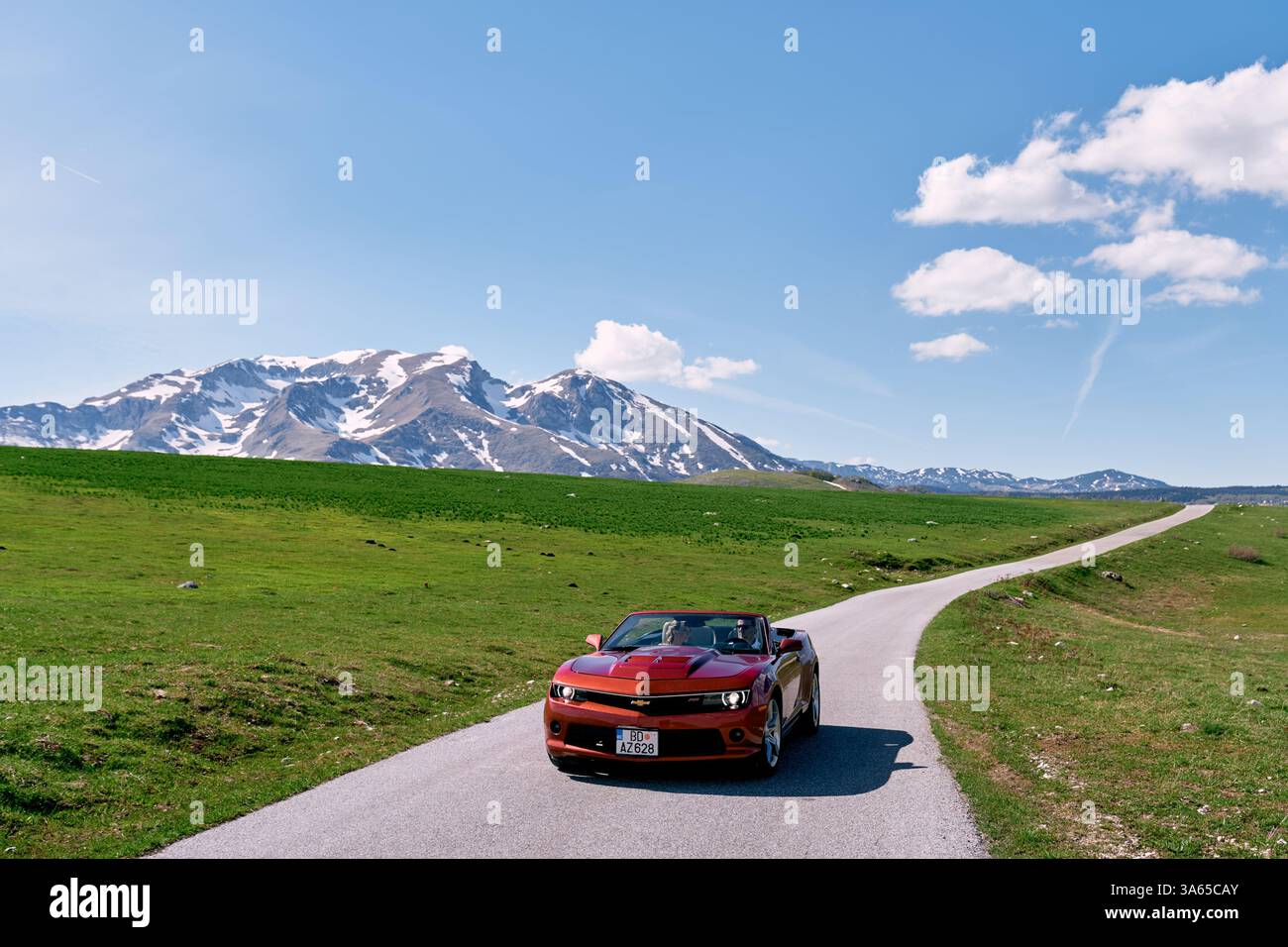 Montenegro, Zabljak - May 09, 2024: Bride and groom are driving in a ...