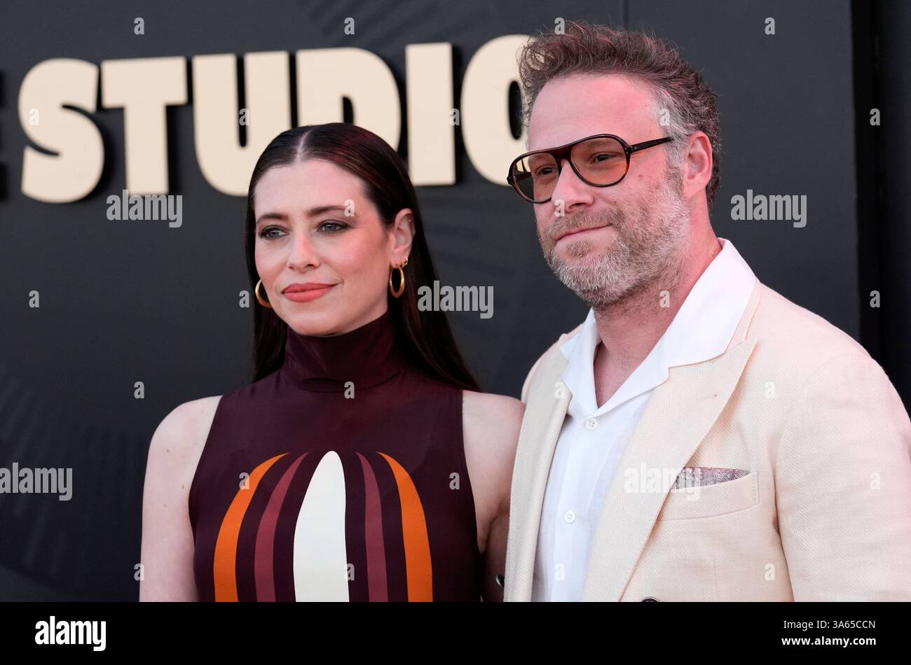 Seth Rogen, right, and his wife Lauren Miller pose together at the ...
