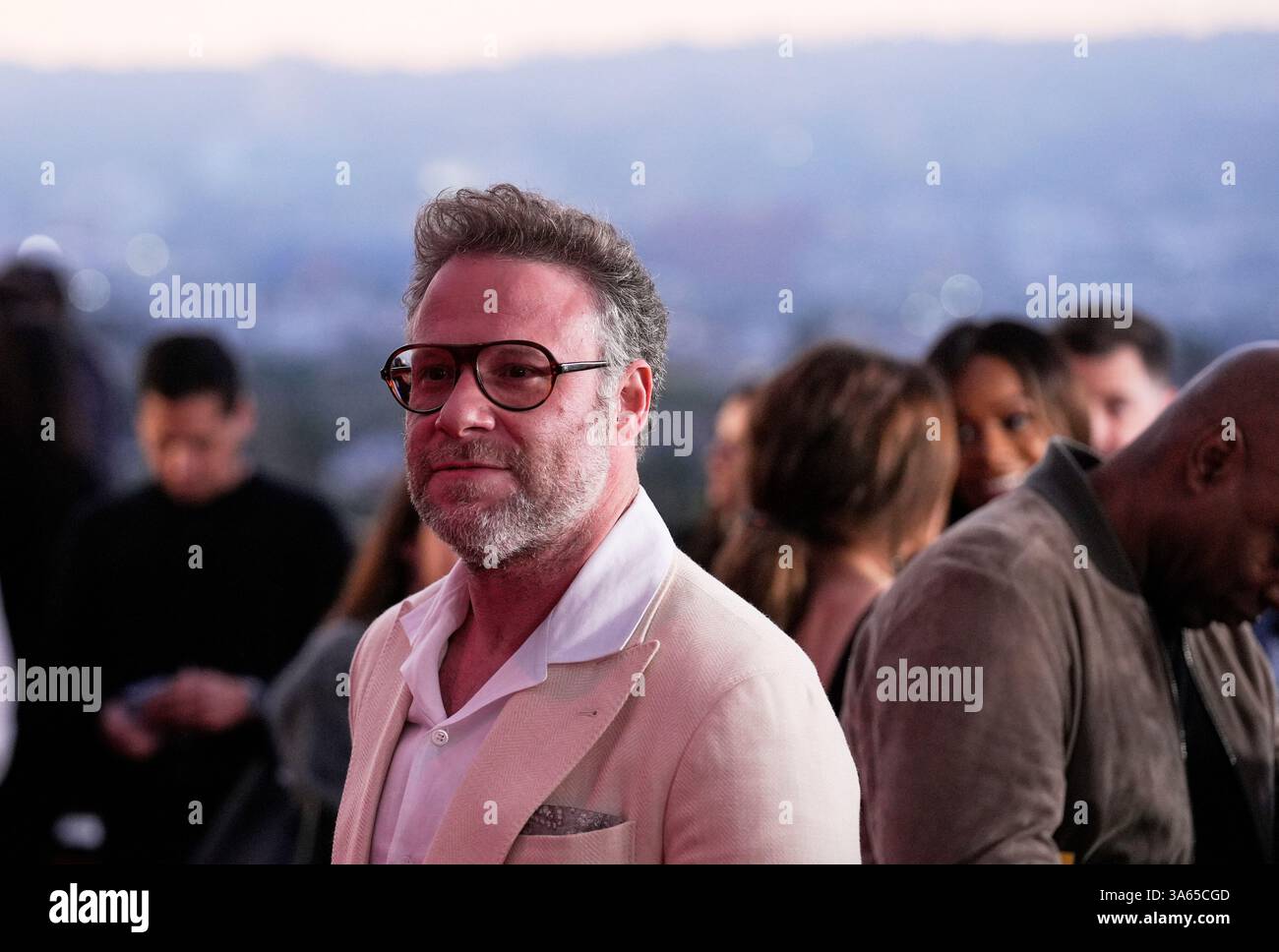 Seth Rogen looks down the carpet at the premiere of the Apple TV+ ...