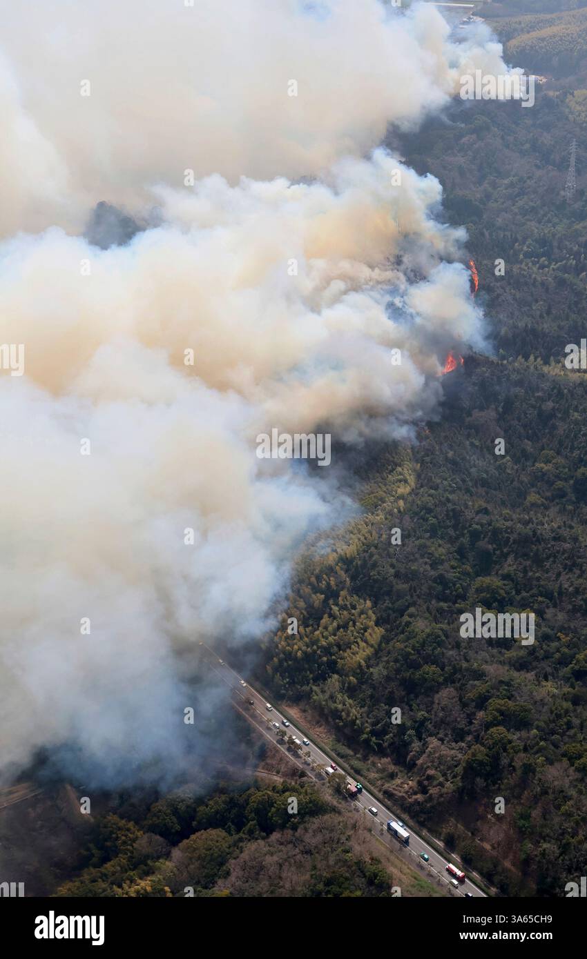 An aerial photo shows a spreading forest fire in Imabari, Ehime ...