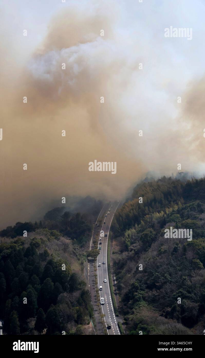 An aerial photo shows a spreading forest fire in Imabari, Ehime ...
