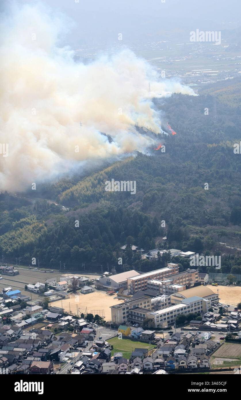 An aerial photo shows a spreading forest fire in Imabari, Ehime ...