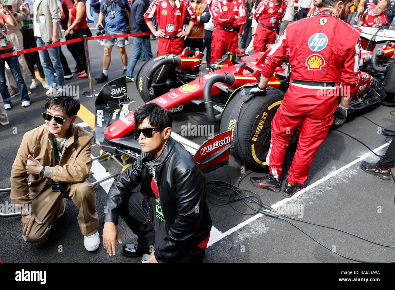 Jimmy Lin (left) and Jay Chou pose for photos in front of the racing ...