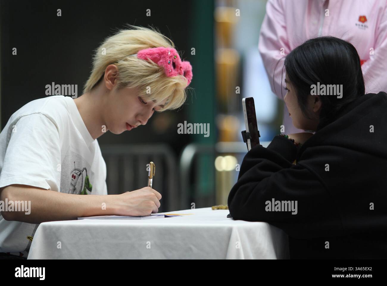 Chinese singer Zhao Rang attends an activity in Wuhan City, central ...