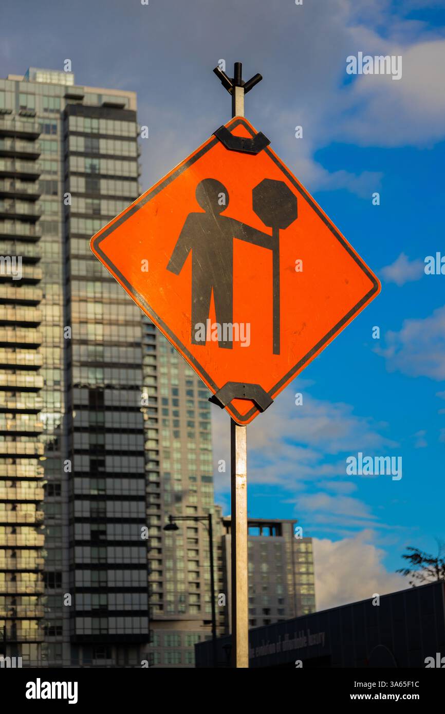 Flagman Ahead Stop Sign in Vancouver with urban background, March 2025 ...