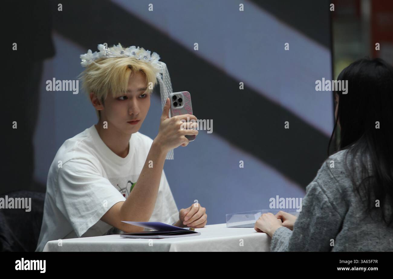 Chinese singer Zhao Rang attends an activity in Wuhan City, central ...