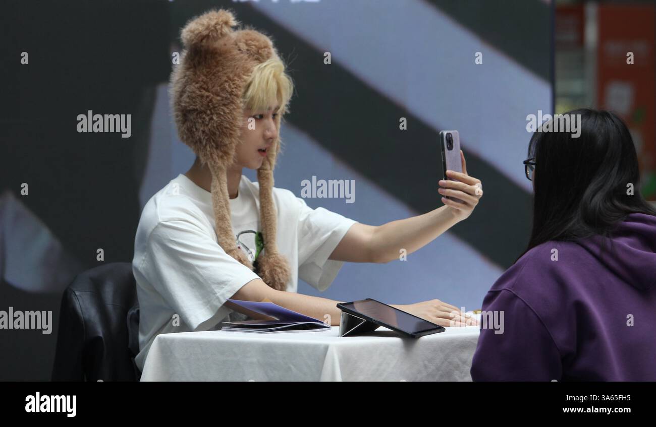 Chinese singer Zhao Rang attends an activity in Wuhan City, central ...