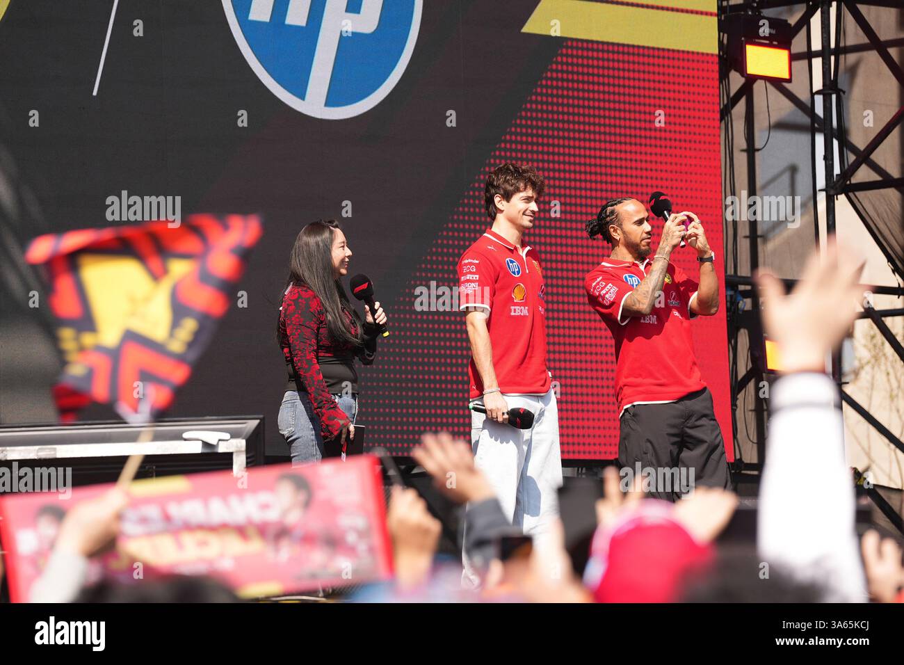 Ferrari's Hamilton (1st from right) and Leclerc (Middle) meet with fans ...