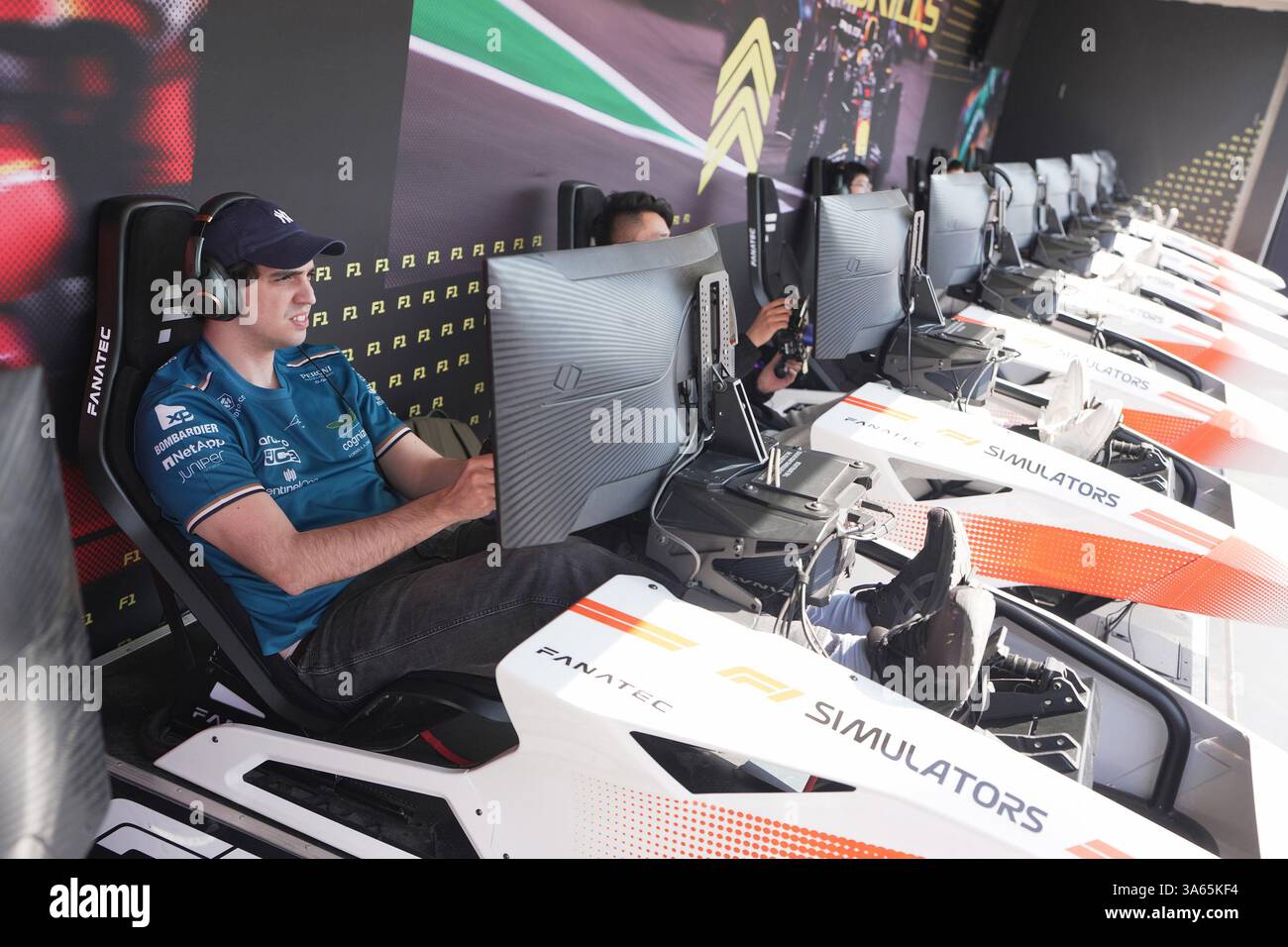 Foreign F1 fans experience racing simulators, March 21, 2025. Shanghai ...