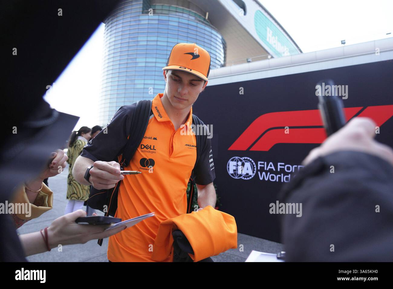 McLaren's Piastri signs for fans, March 21, 2025. Shanghai,China.21th ...