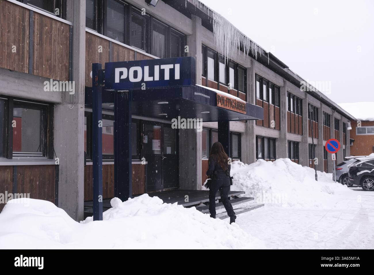 Nuuk, Denmark. 24th Mar, 2025. A police officer enters a police station ...