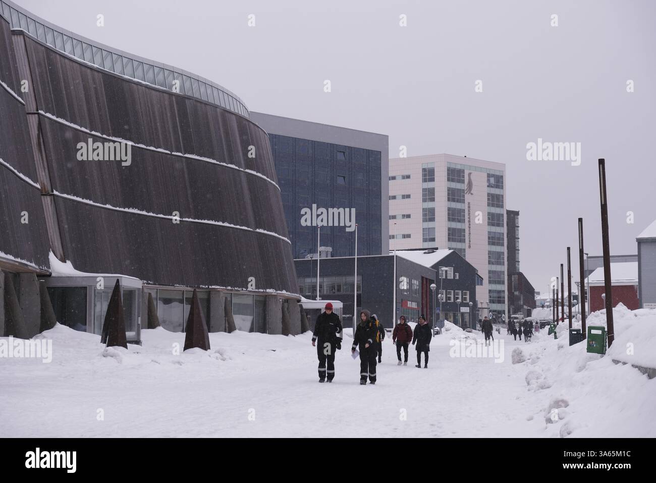 Nuuk, Denmark. 24th Mar, 2025. People walk in downtown Nuuk, capital of ...