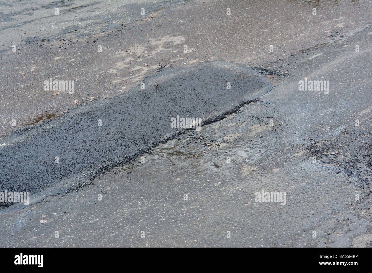 Asphalt patching pothole repairs. Asphalt pavement pothole repair Stock ...