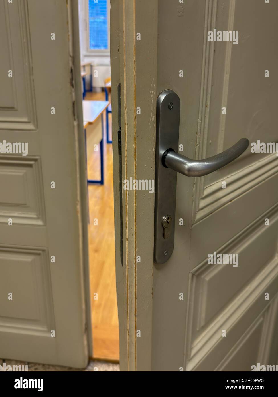 Open Door to Empty Classroom with Desks in Background Stock Photo - Alamy
