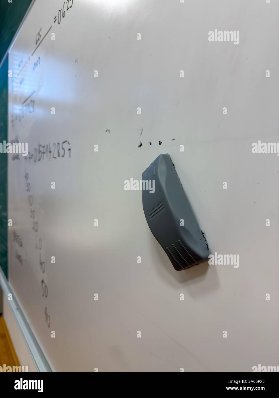 Whiteboard with Eraser and Math Equations in Classroom Stock Photo - Alamy