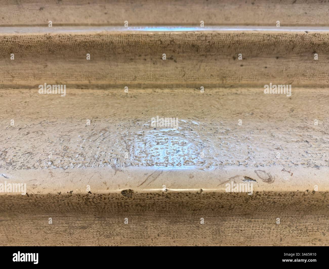 Close-up view of aged, worn stone steps showing surface textures ...