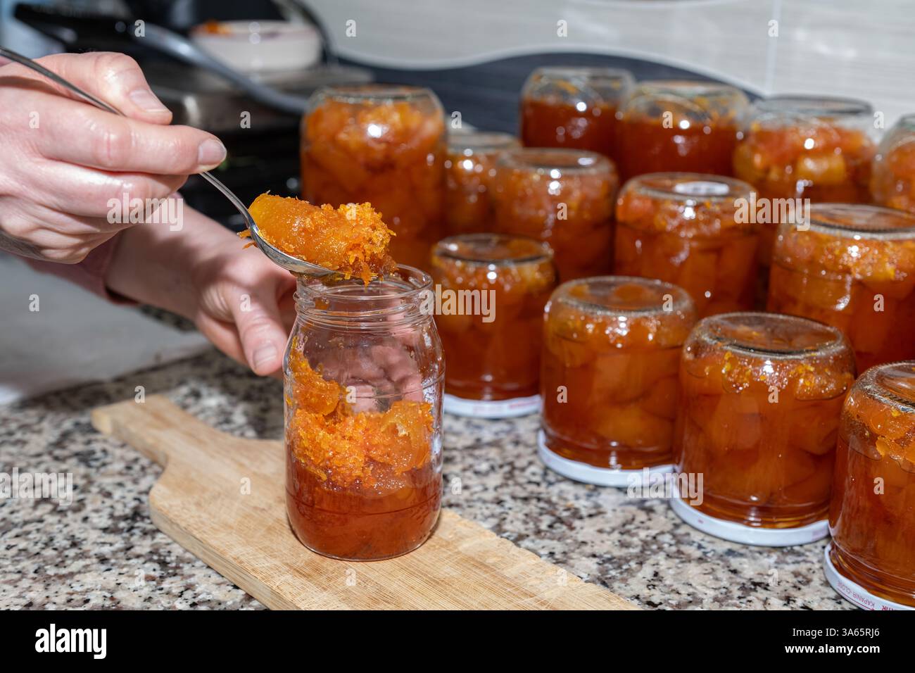 Woman puts cooked jam hi-res stock photography and images - Alamy
