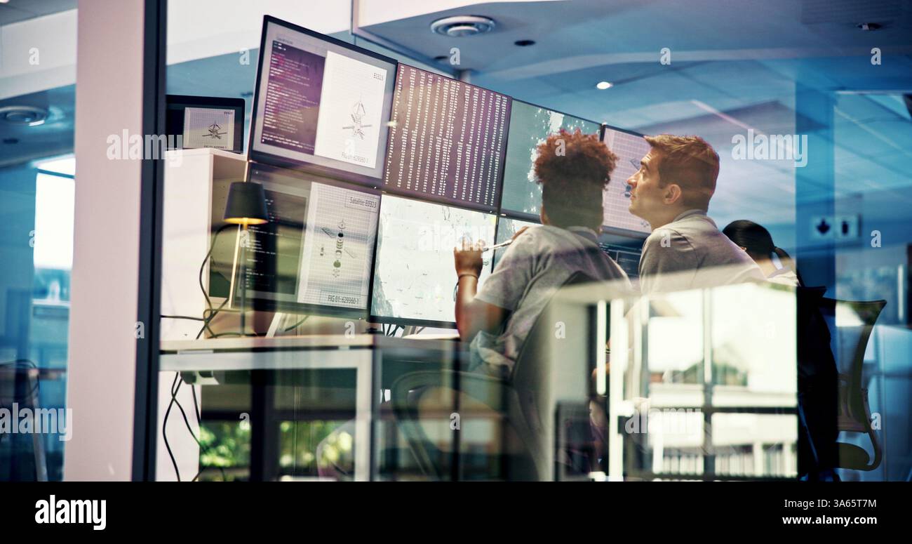 People, control room and monitor satellite with maps to track ...