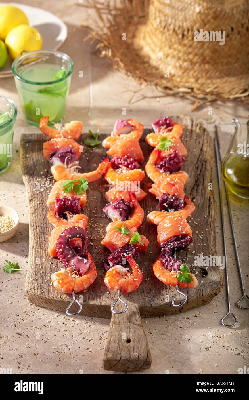 Preparation of spicy grilled skewer as healthy summer appetizer. Summer ...