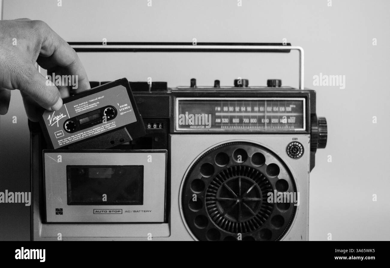 Madrid, Spain. May 2, 2023 A man put music cassette into an old record ...