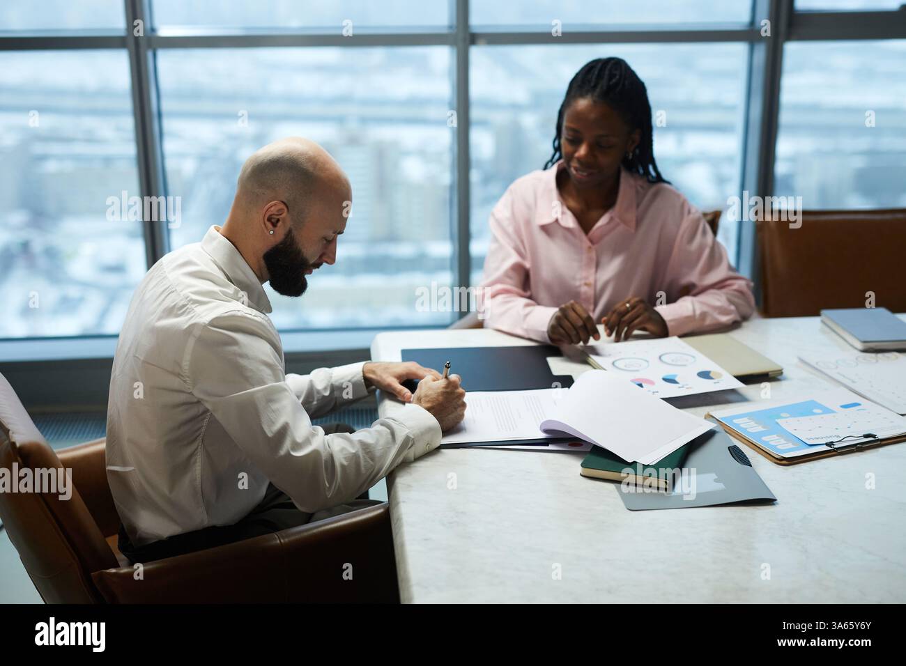 African american businessman signing contract hi-res stock photography ...