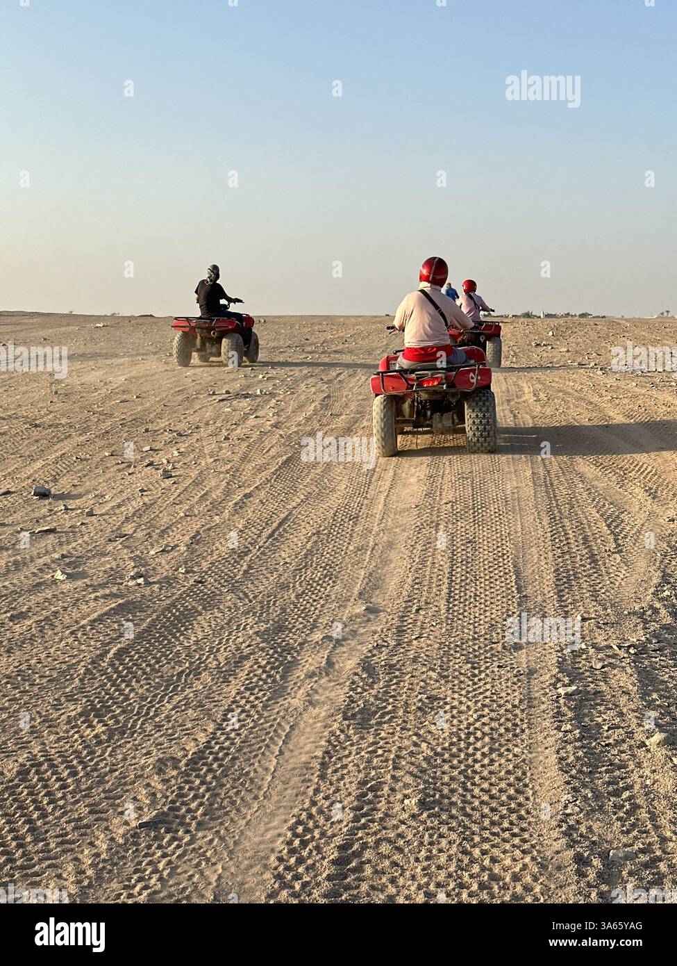 Quad bike adventure through the desert in a sunny afternoon at Hurghada ...