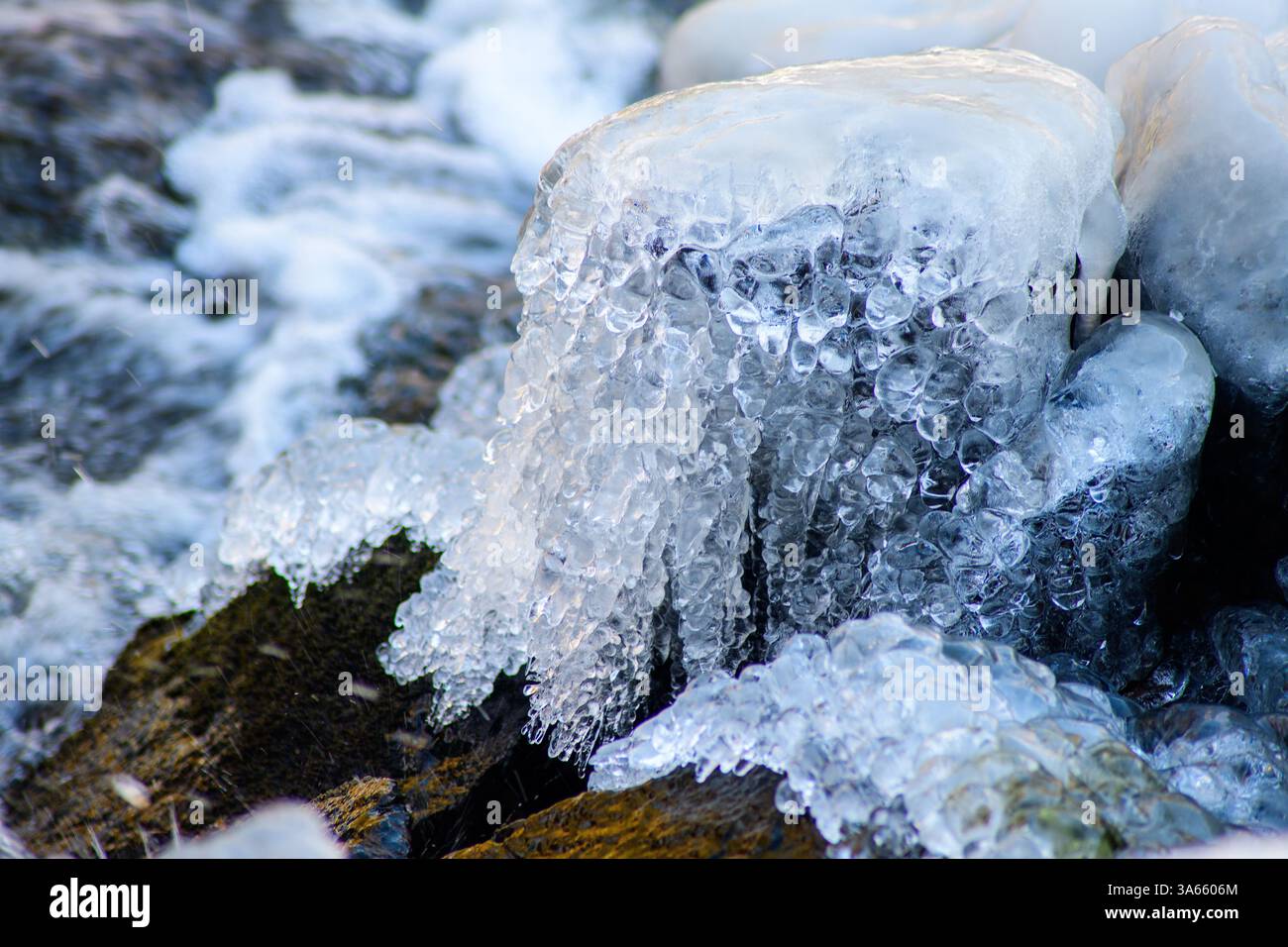 Beautiful ice formation on boulders and rocks. Winter art of bubble ...