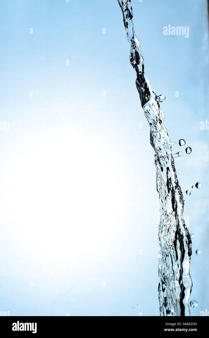 Pouring Water Stream Isolated on Light Stock Photo - Alamy
