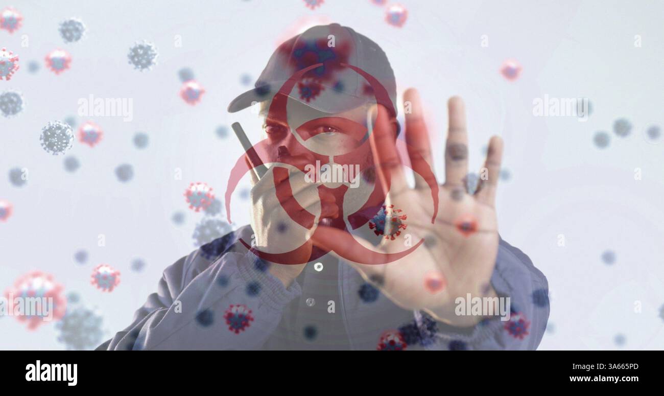 Image of a hazard sign with cells floating over biracial man using ...