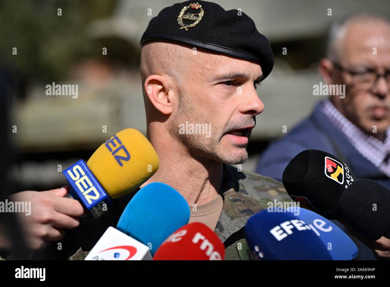 Spanish army personnel attend to the media during a visit of King ...