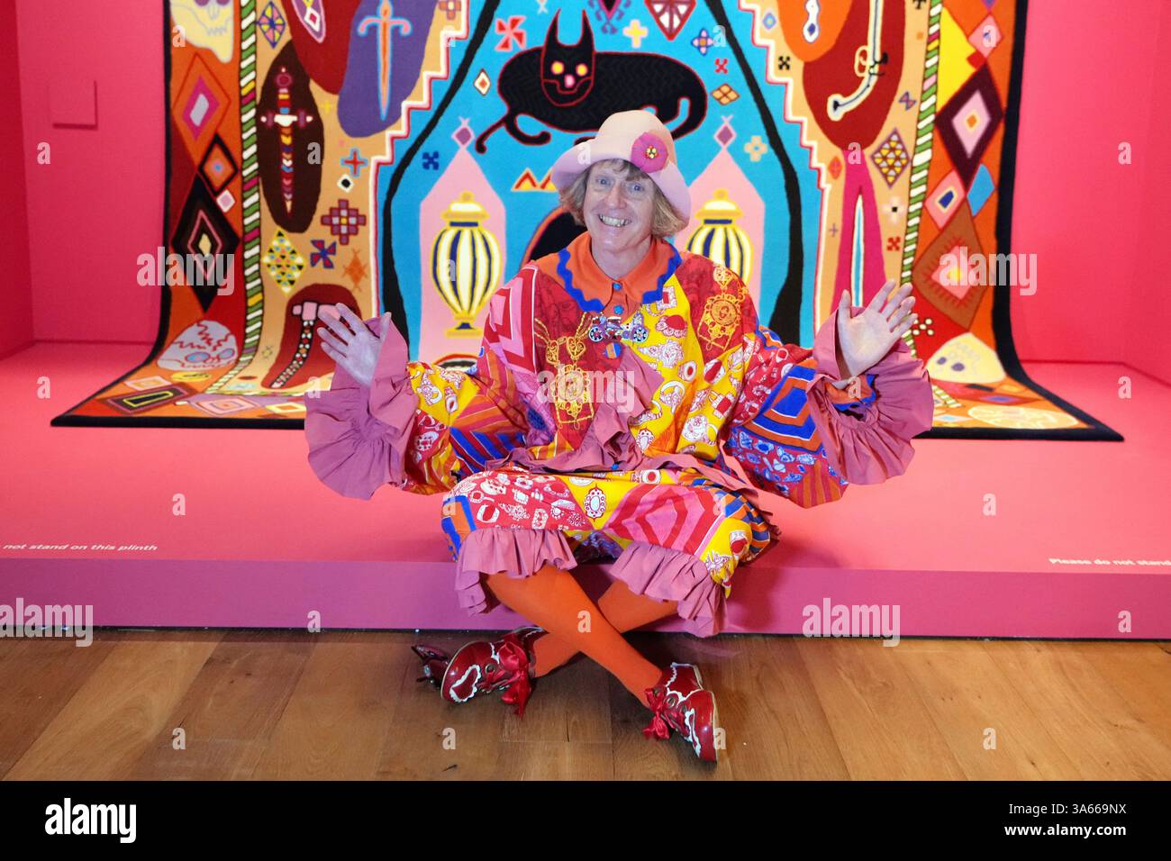 Artist Sir Grayson Perry poses in front of one of his artworks on ...