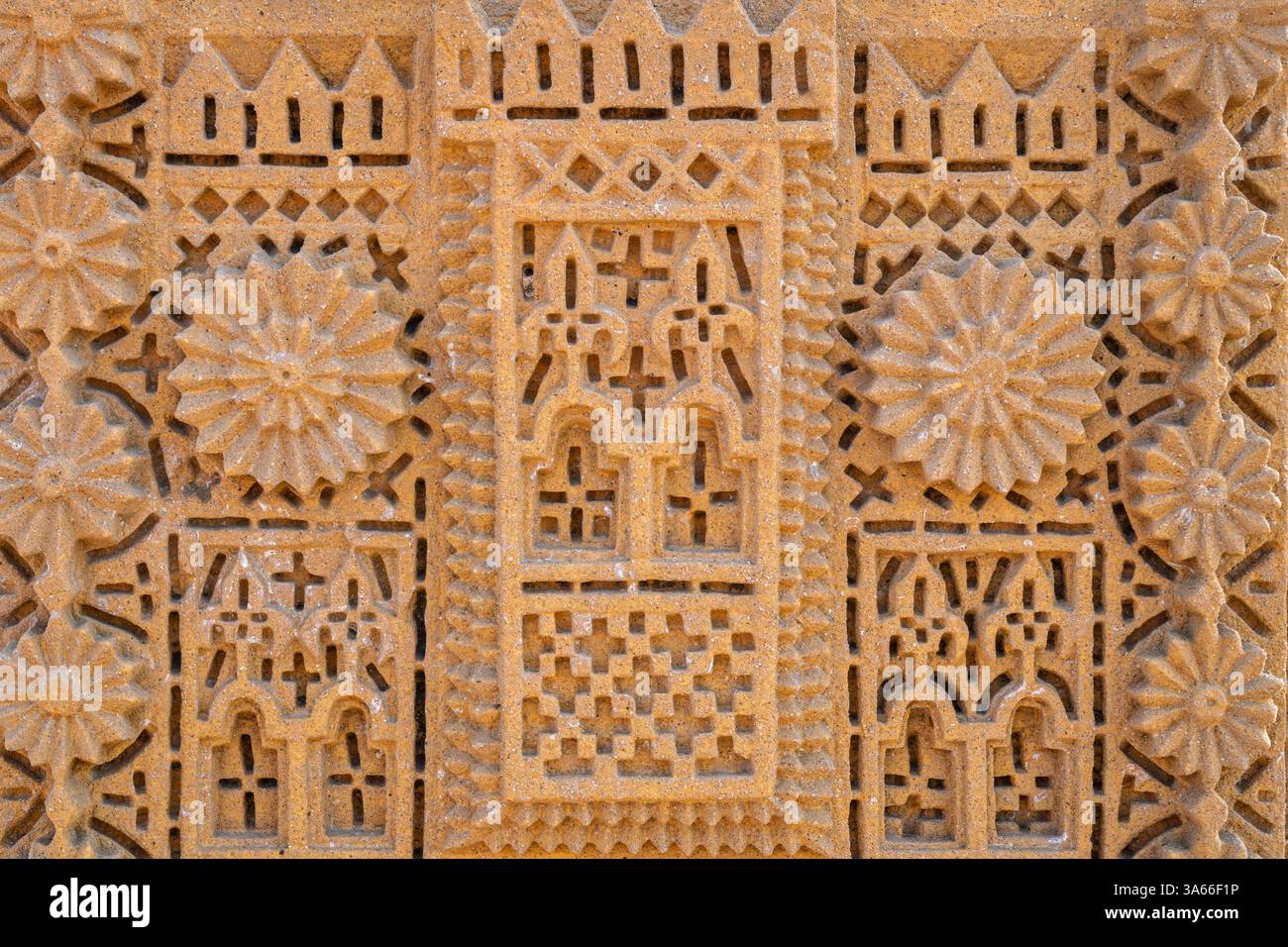 Closeup view of intricate traditional carving on sandstone grave ...