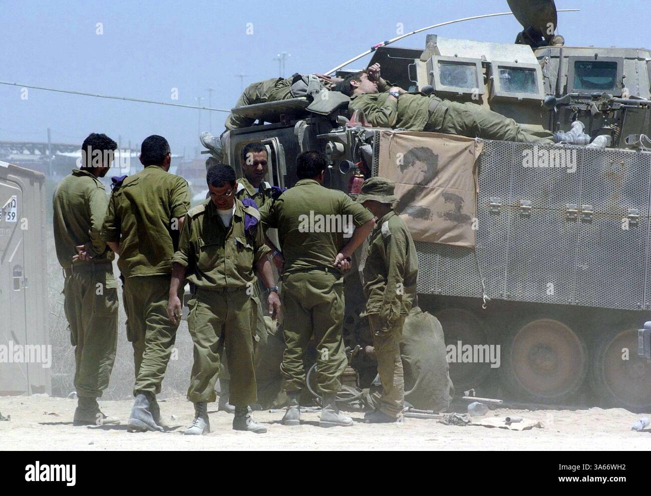 May 12, 2004; Karni Crossing, Israel; Israeli soldiers gather around ...