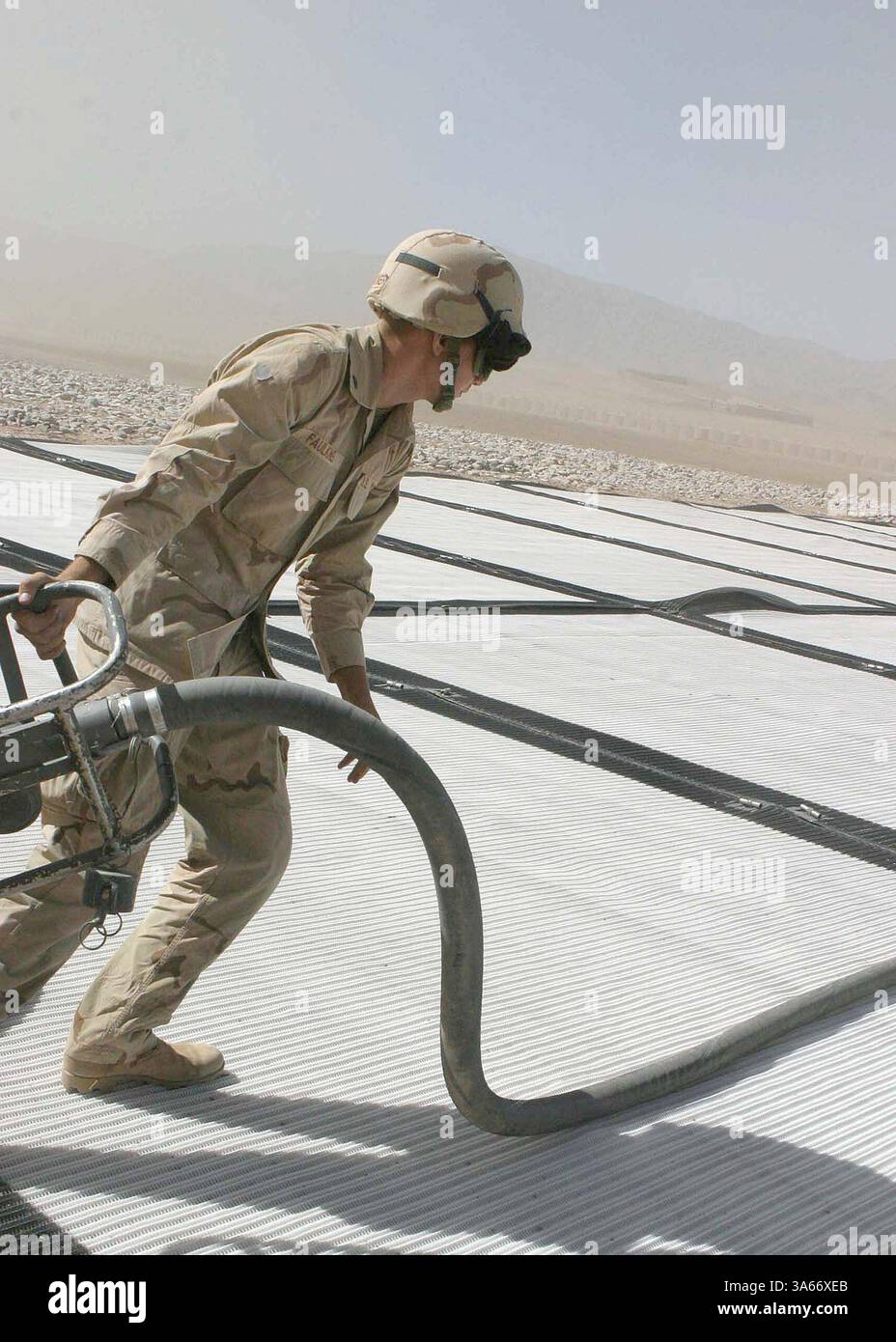 May 22, 2004; FOB Ripley, Afghanistan; Lance Cpl. JUSTIN FAULKNER drags ...