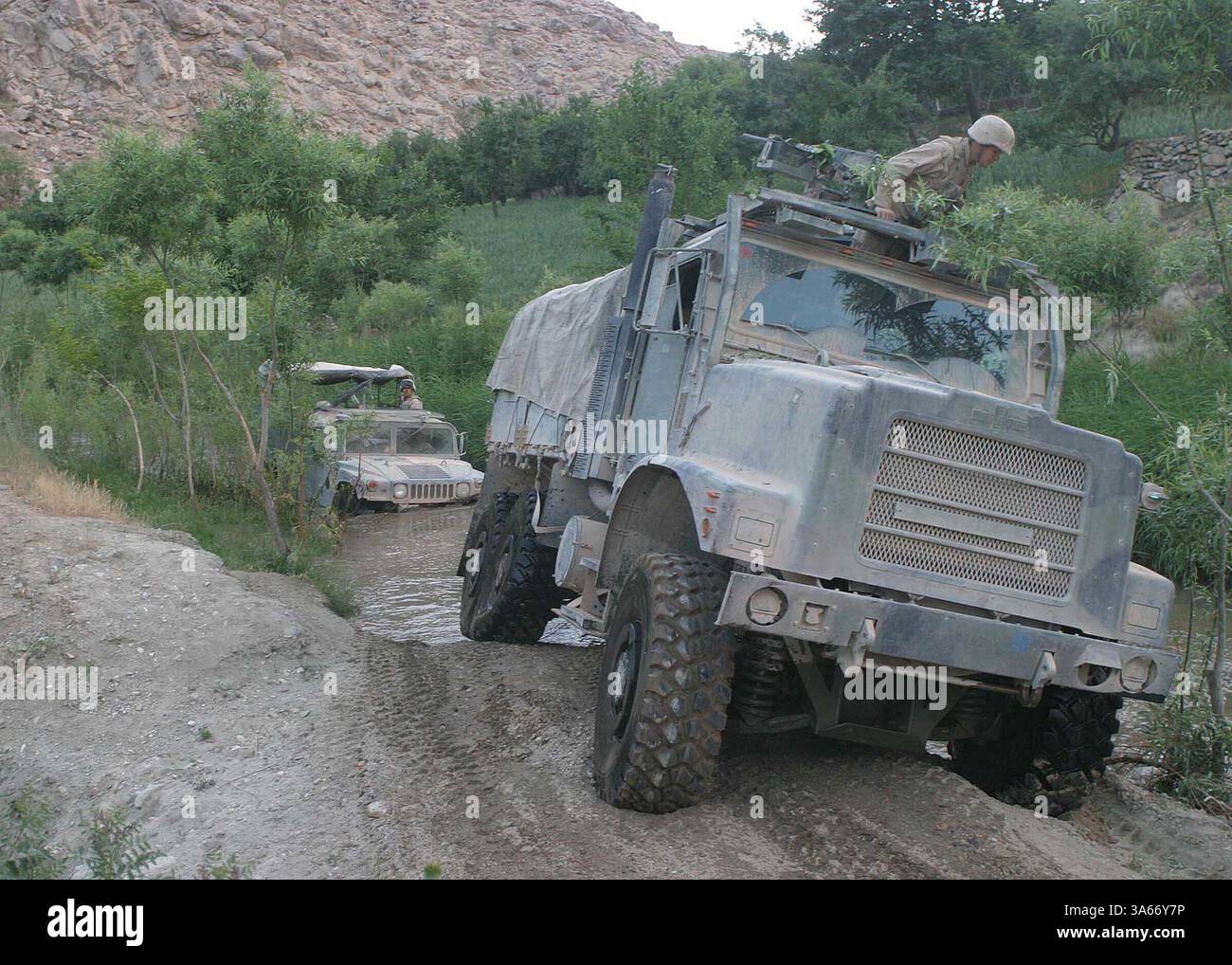 May 28, 2004; Oruzgan, Afghanistan; A seven-ton truck emerges from a ...