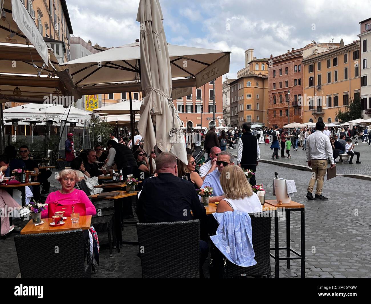 Rome, Italy - March 2025 - Tourists eating at cafe in Piazza Navona ...