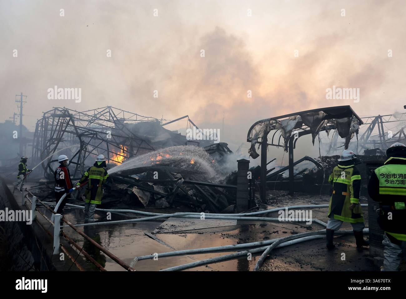Firefighters struggle to extinguish the fire in Imabari, Ehime ...