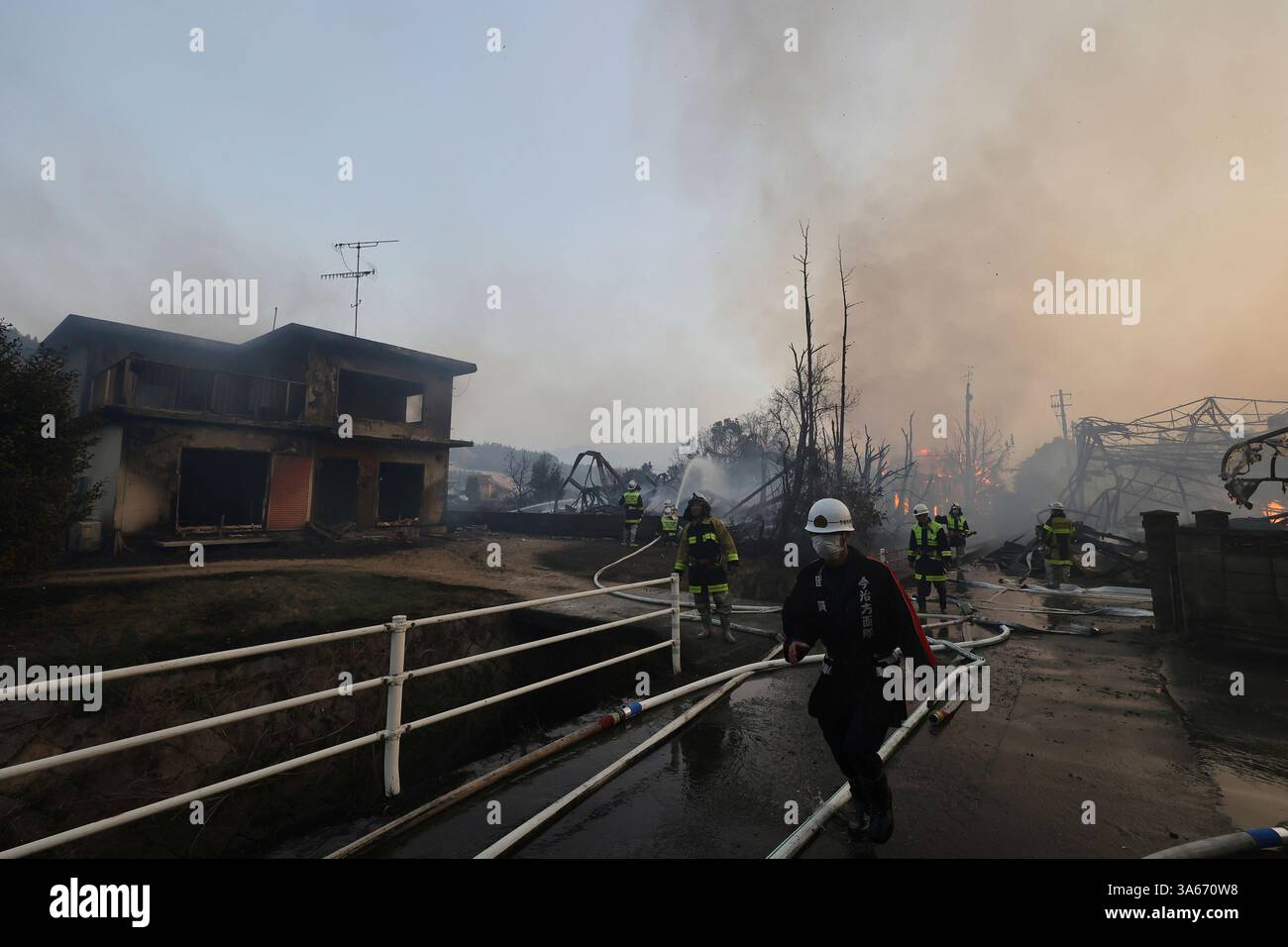 Firefighters struggle to extinguish the fire in Imabari, Ehime ...