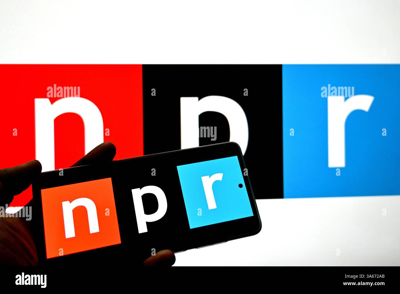 In this photo illustration, a NPR logo is seen displayed on a ...