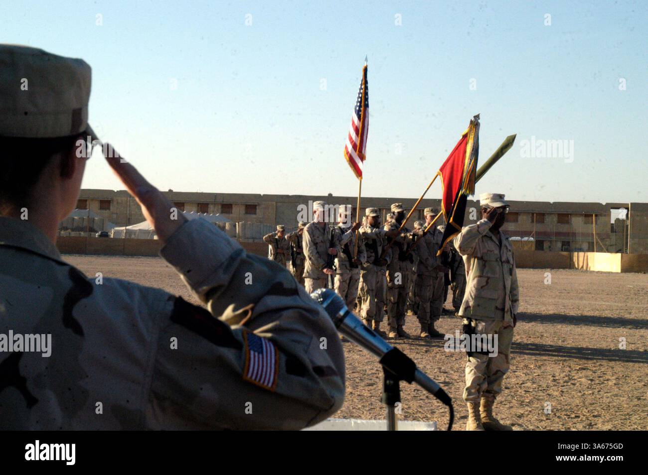 Sep 11, 2004; Camp Ramadi, Iraq; Soldiers salute the colors during the ...