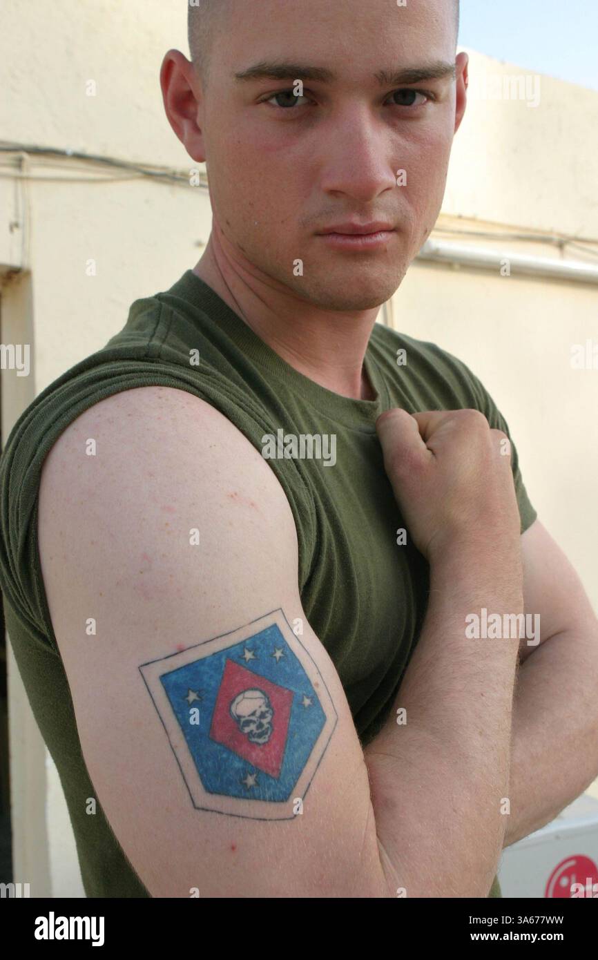 Sep 26, 2004; FOB Echo, Iraq; Lance Cpl. STEPHEN T. VINCENT shows the tattoo he and Pfc ...