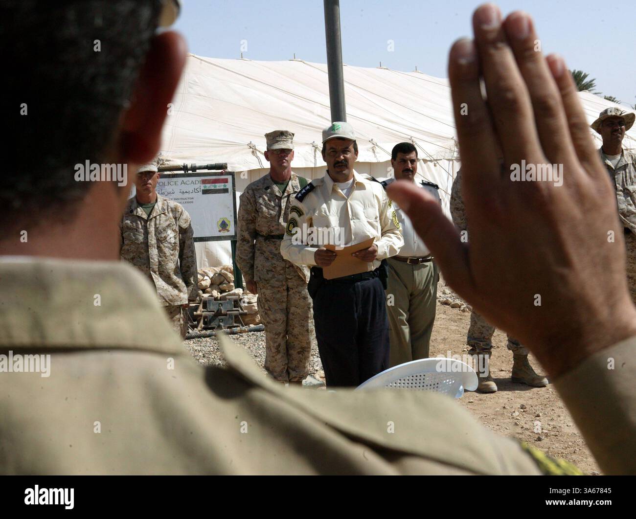 Oct 03, 2004; Al Asad, Iraq; A graduate of the Al Asad Border Police ...