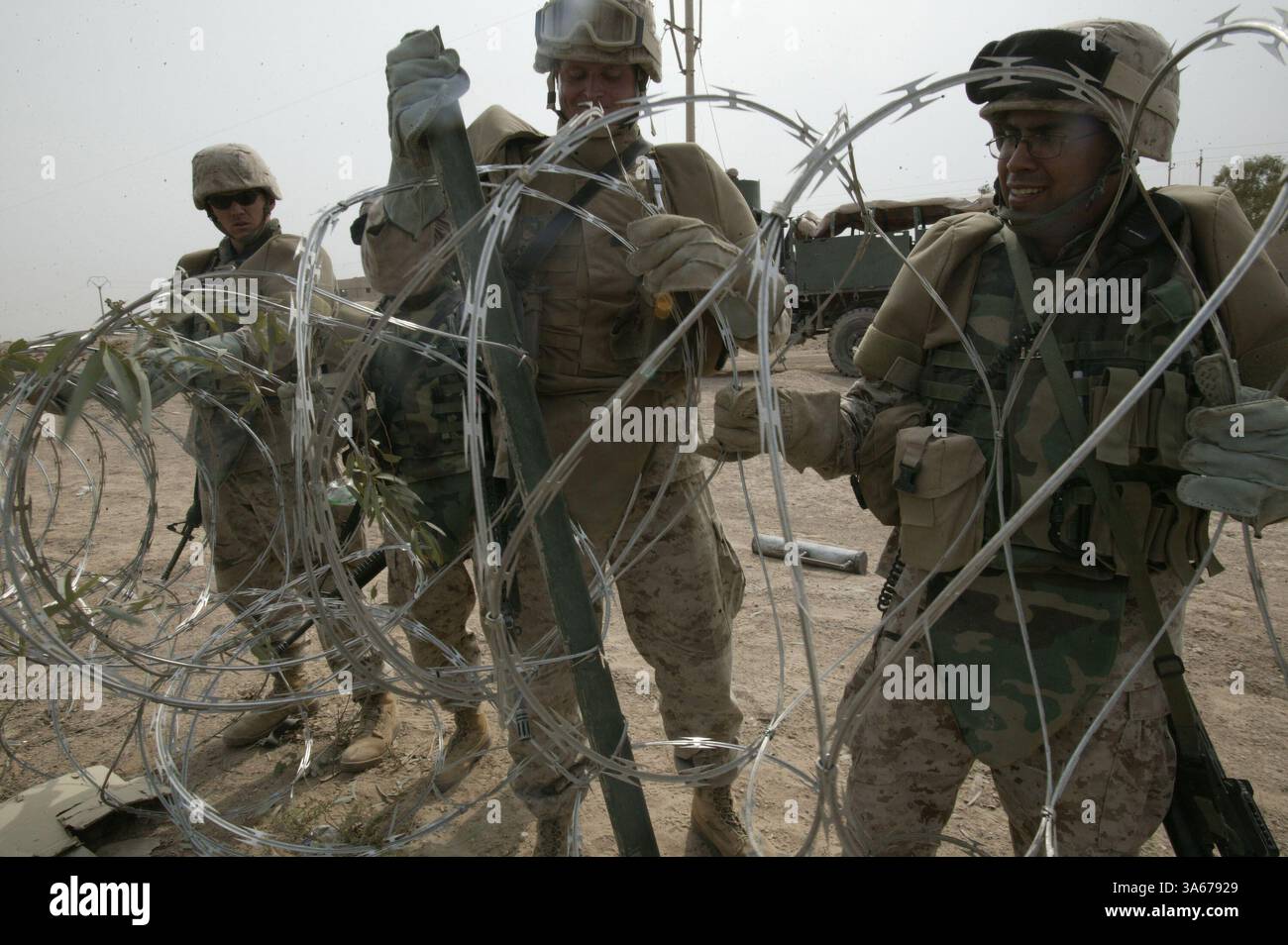 Oct 13, 2004; Camp Baharia, Iraq; Marine engineers with Charlie Company ...